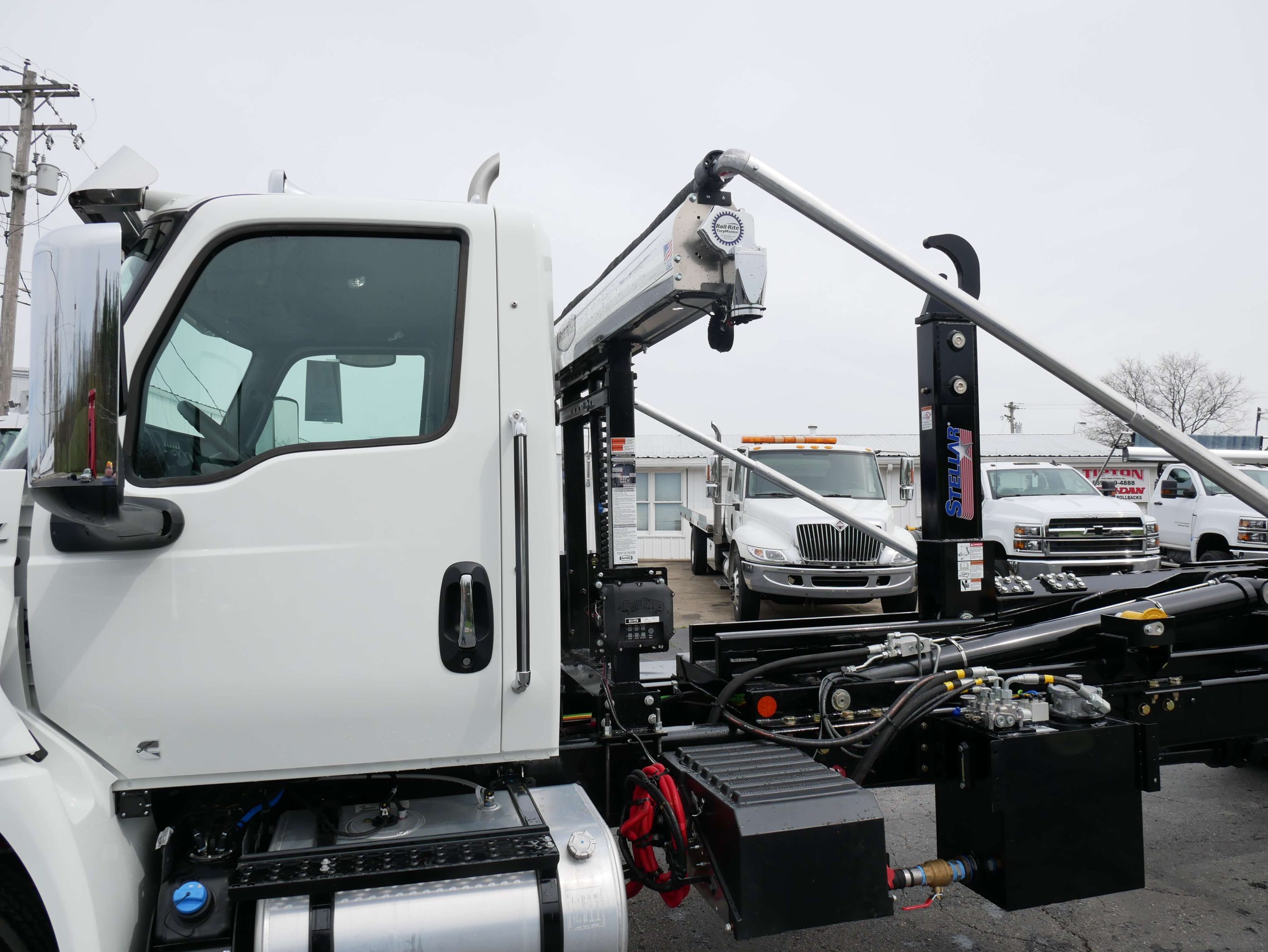 2023 International MV607 - Stellar Slider 34 Hooklift - Tipton Tow Trucks