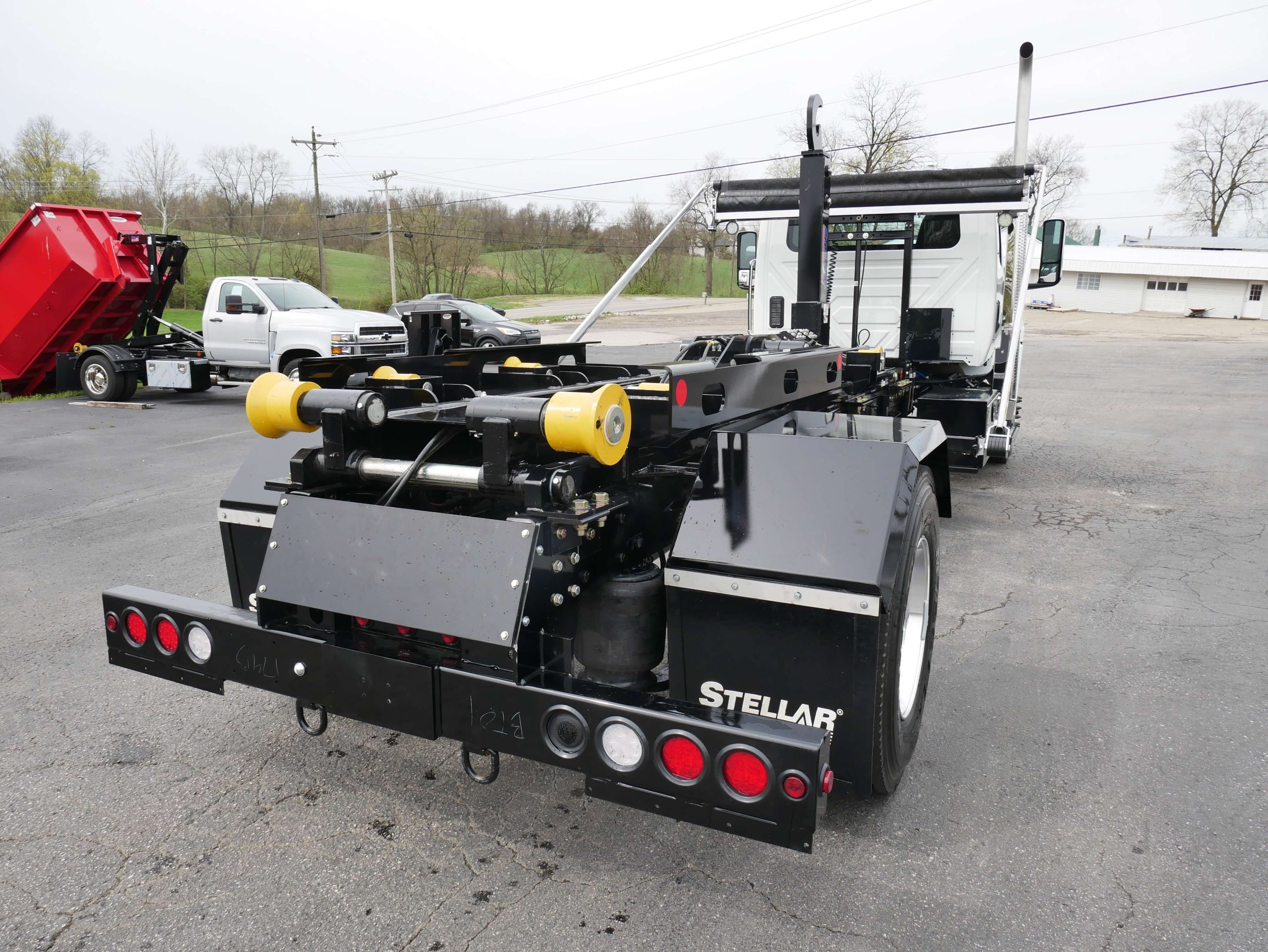 2023 International MV607 - Stellar Slider 34 Hooklift - Tipton Tow Trucks